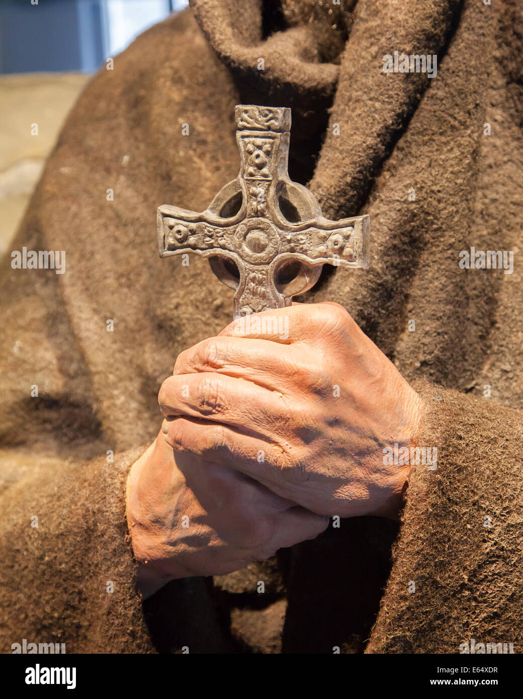 Religious statue, monk with a cross in his hands Stock Photo - Alamy