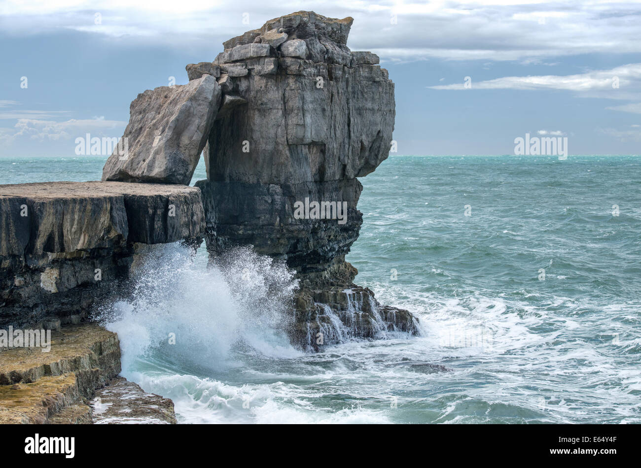 Waves crash against the shoreline at Pulpit Rock on a windy day at ...