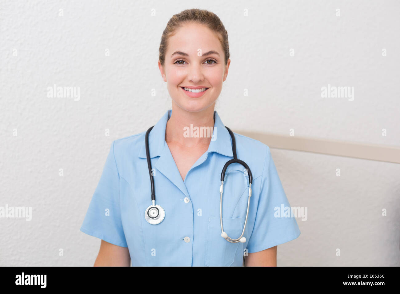 Dental assistant smiling at camera Stock Photo - Alamy