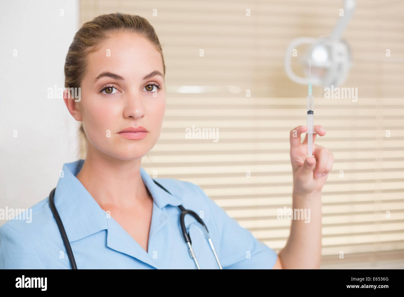 Dental assistant preparing an injection Stock Photo - Alamy