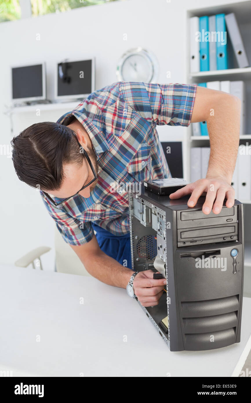 Computer engineer working on broken console Stock Photo - Alamy