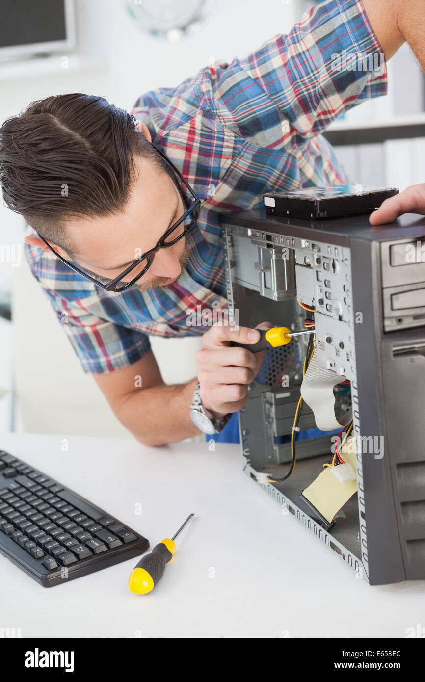 Computer engineer working on broken console Stock Photo - Alamy