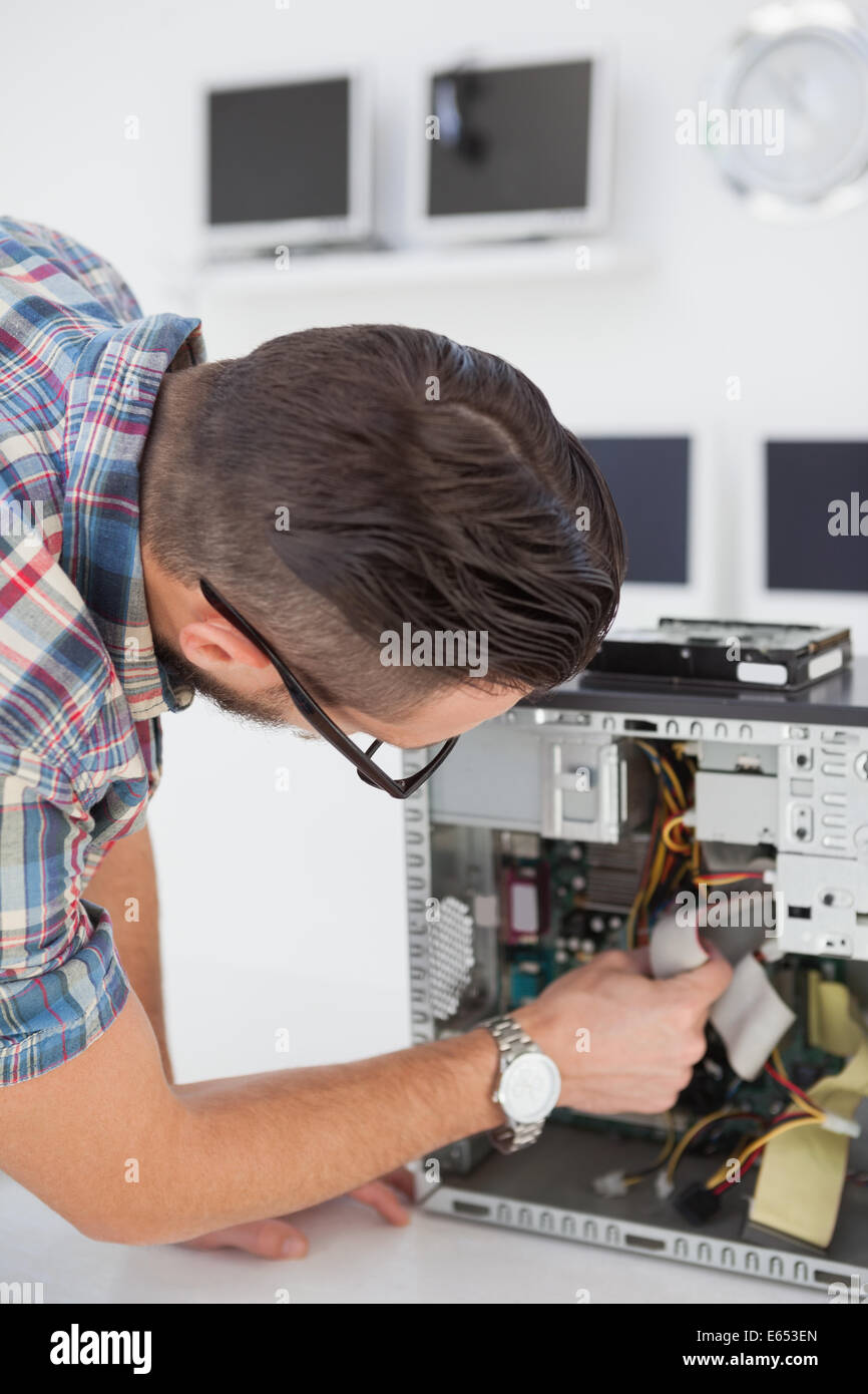 Computer engineer working on broken console Stock Photo - Alamy