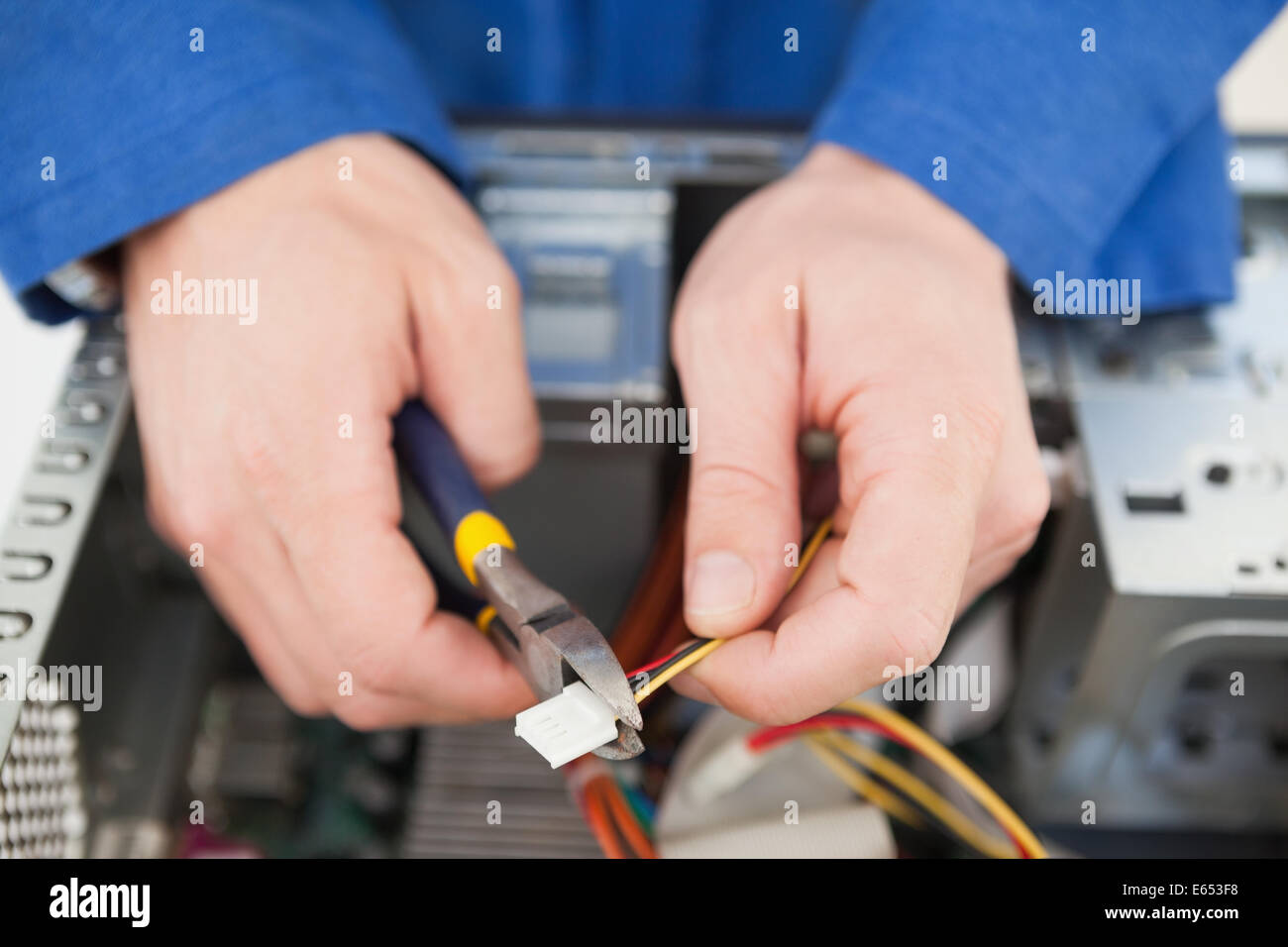 Computer engineer working on broken cable Stock Photo - Alamy