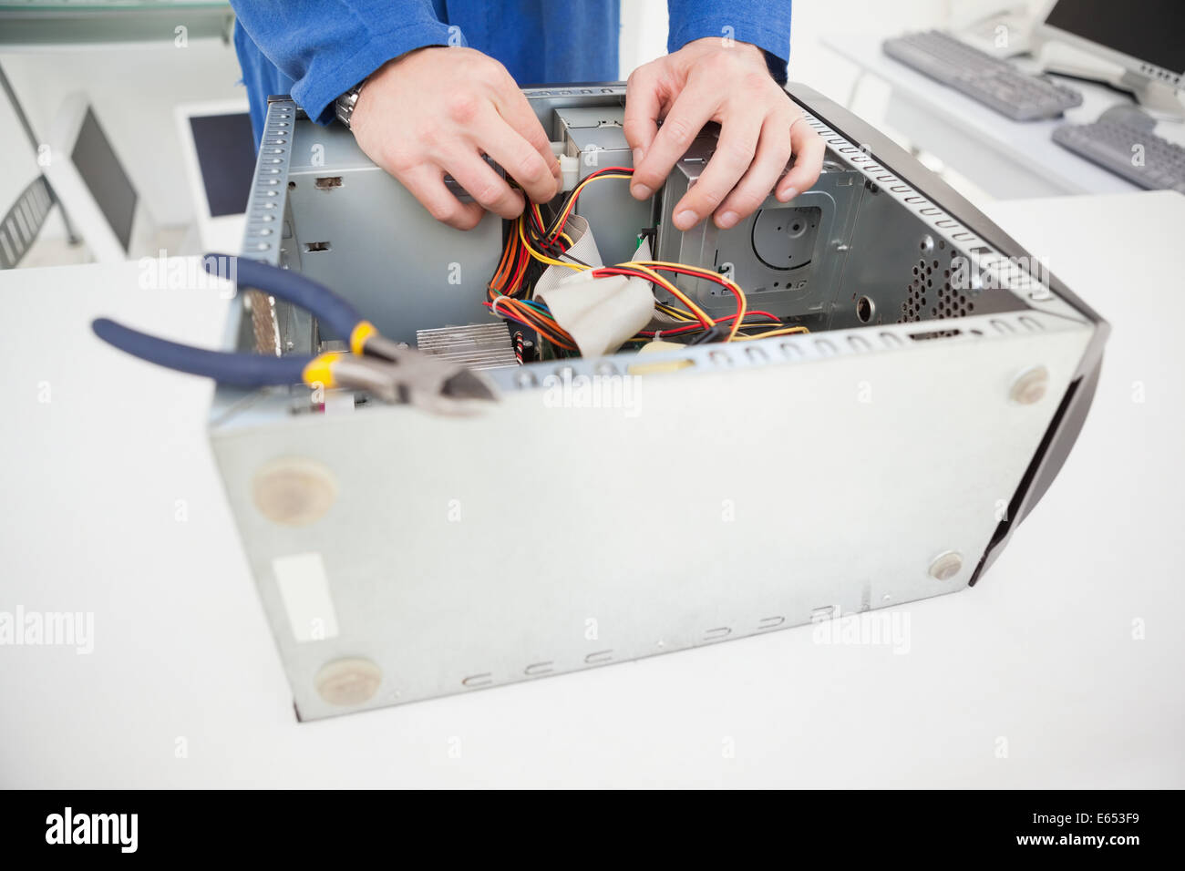 Computer engineer working on broken cables Stock Photo - Alamy