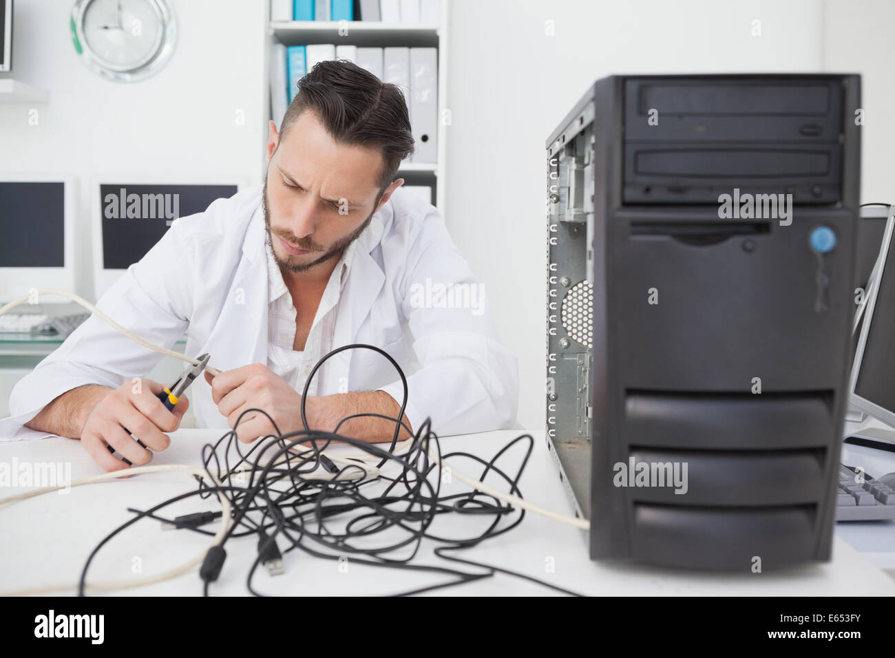 Computer engineer working on broken cables Stock Photo - Alamy