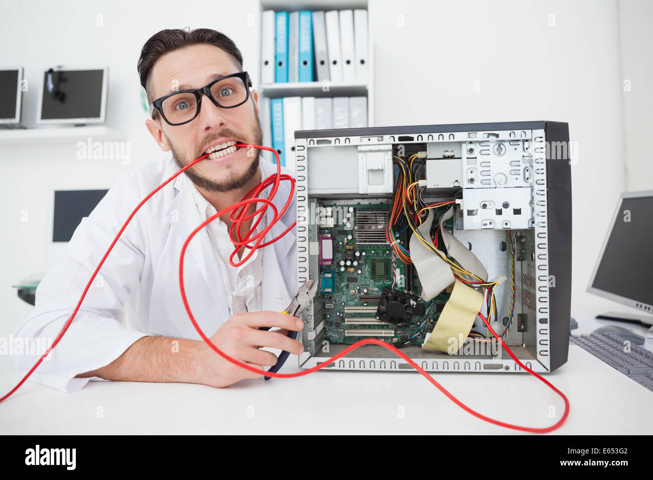 Stressed computer engineer working on broken cables Stock Photo - Alamy Stressed computer engineer working on broken cables Stock Photo - Alamy
