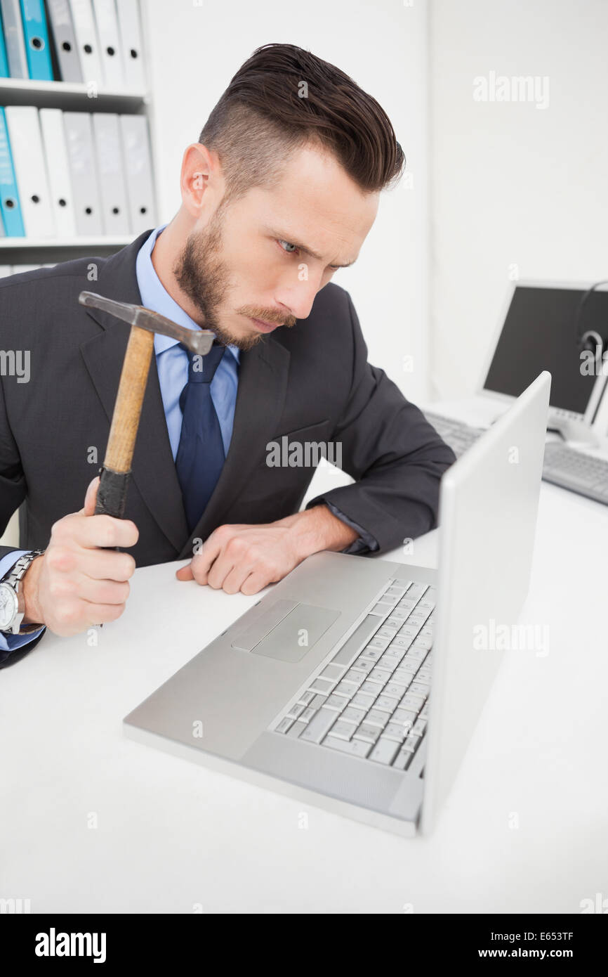Businessman holding hammer hi-res stock photography and images - Alamy