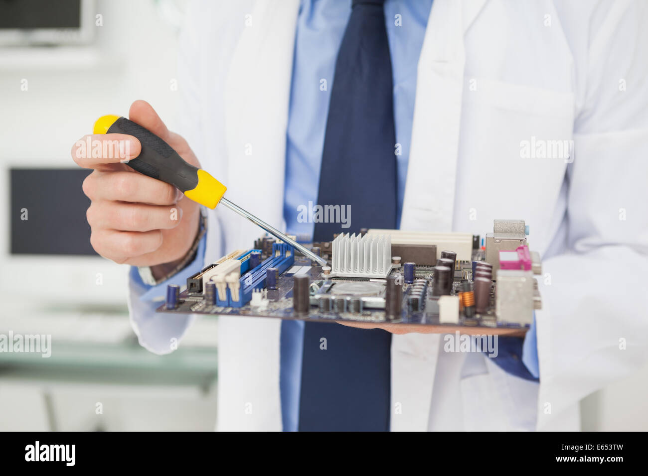 Computer engineer working on broken cpu Stock Photo - Alamy