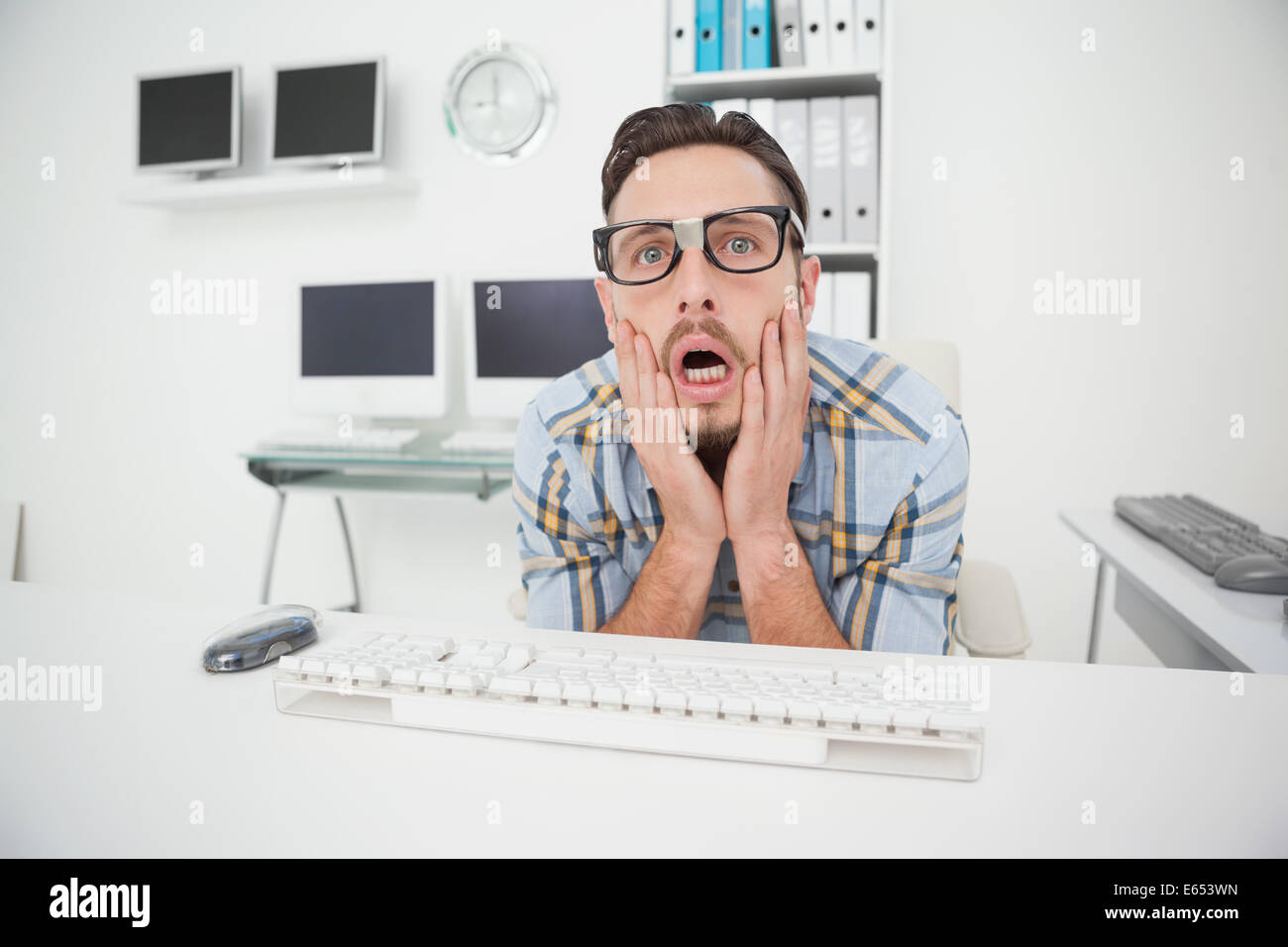 Nerdy businessman working on computer Stock Photo - Alamy