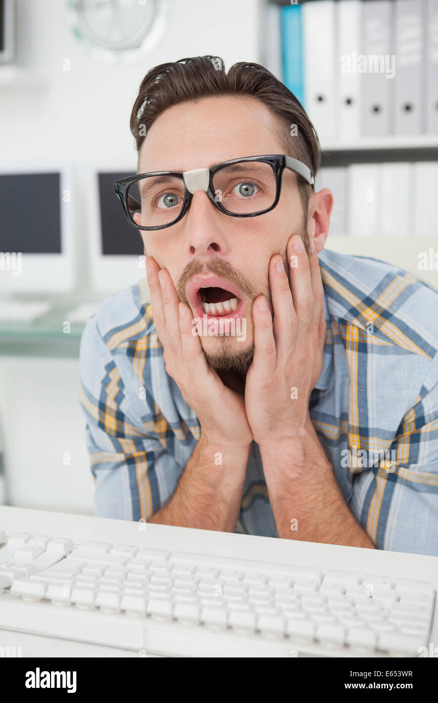 Nerdy businessman working on computer Stock Photo - Alamy