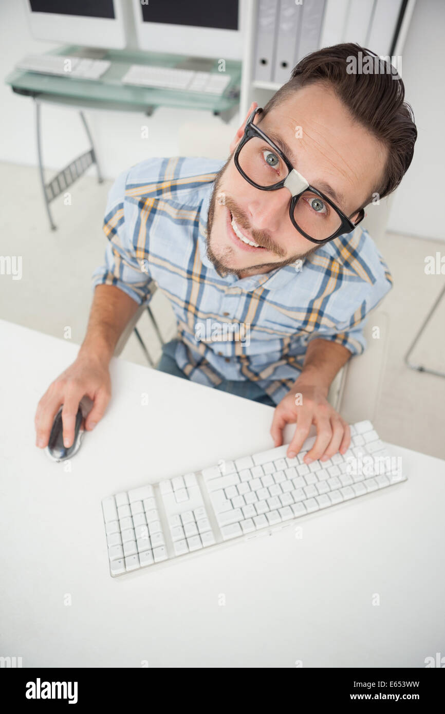 Nerdy businessman working on computer Stock Photo - Alamy