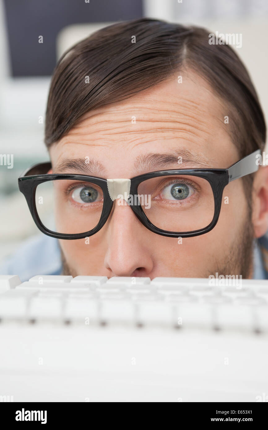 Nerdy businessman working on computer Stock Photo - Alamy
