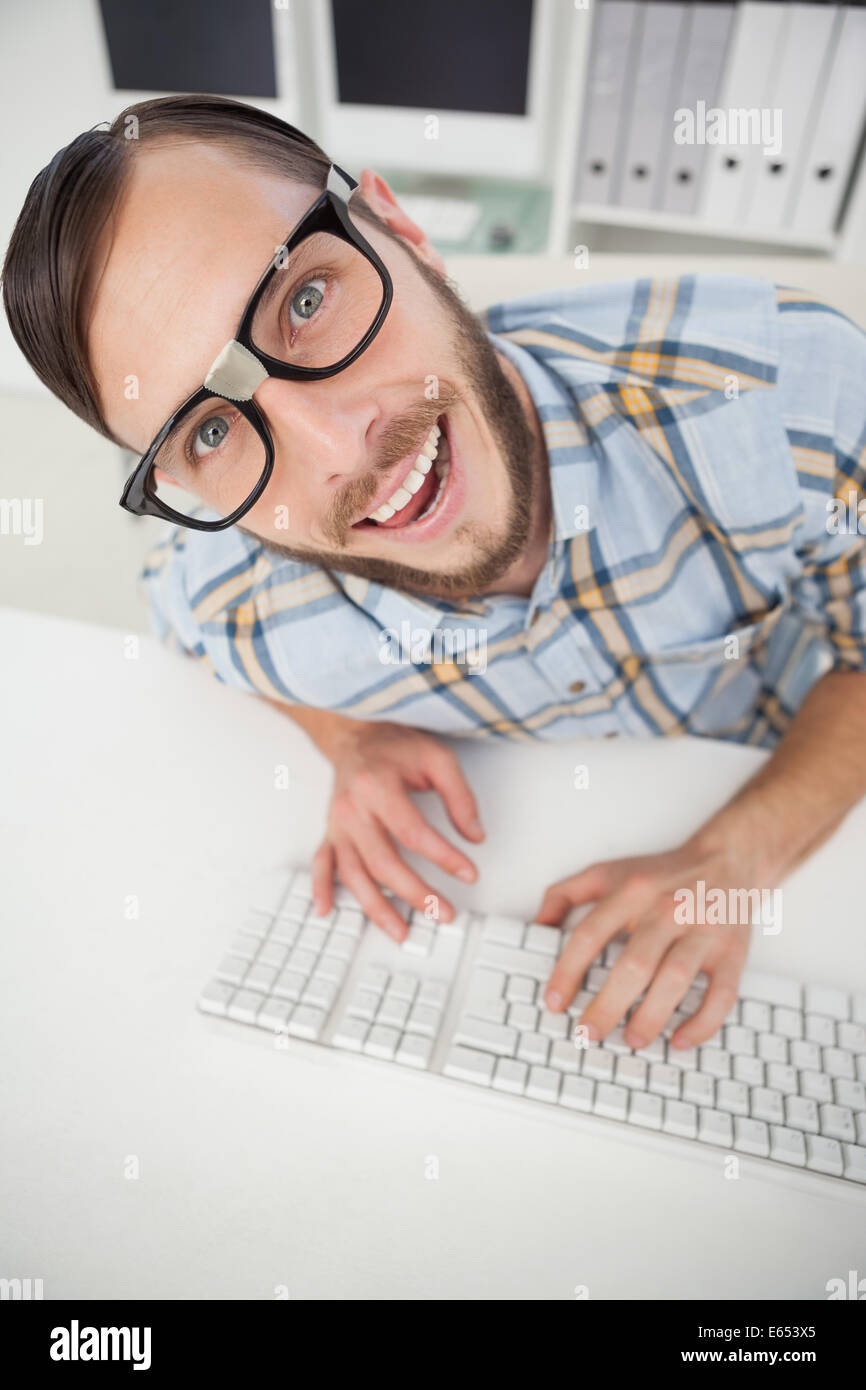 Nerdy businessman working on computer Stock Photo - Alamy