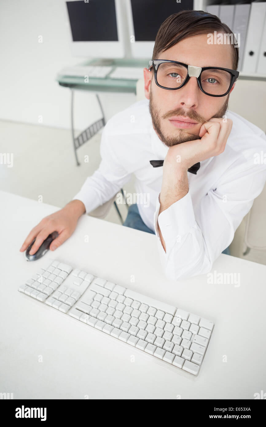 Nerdy bored businessman working on computer Stock Photo - Alamy