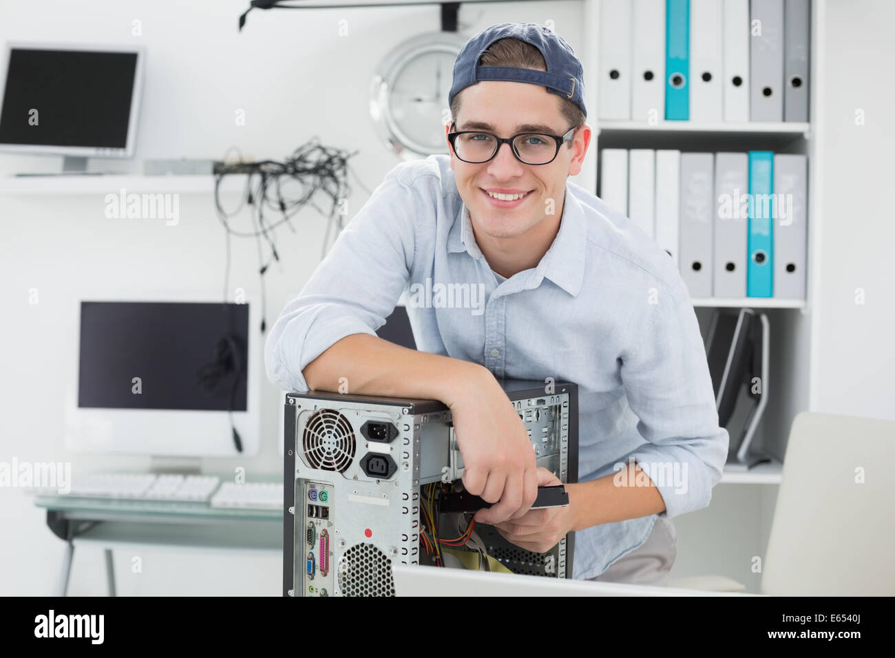 Computer engineer working on broken console Stock Photo - Alamy