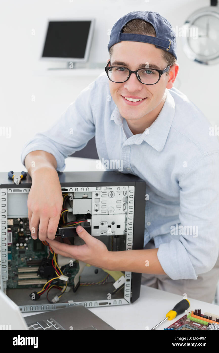 Computer engineer working on broken console Stock Photo - Alamy