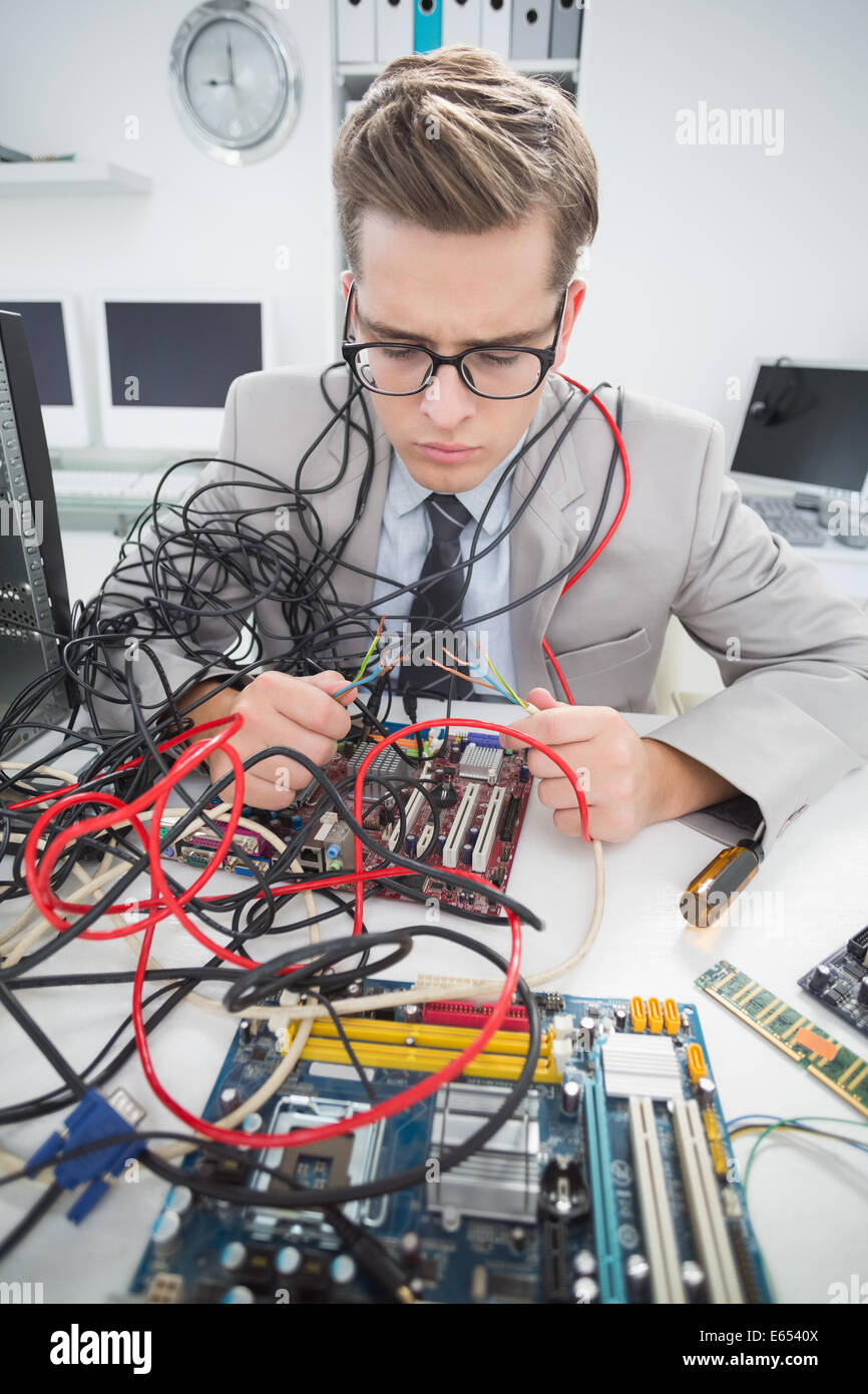 Computer engineer working on broken cables Stock Photo - Alamy