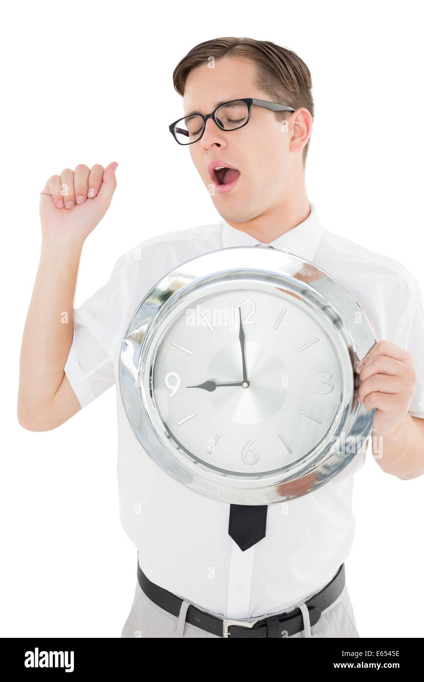 Nerdy businessman showing clock to camera Stock Photo - Alamy