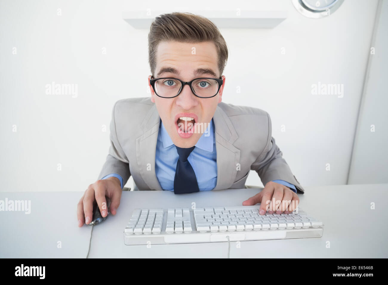 Shocked businessman working on computer Stock Photo - Alamy