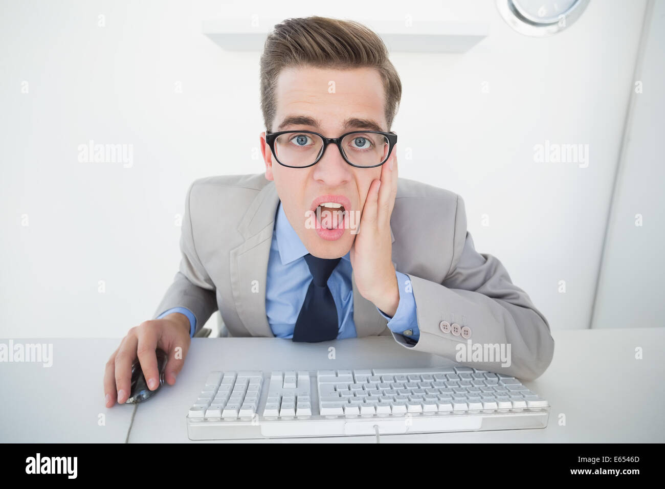Shocked businessman working on computer Stock Photo - Alamy