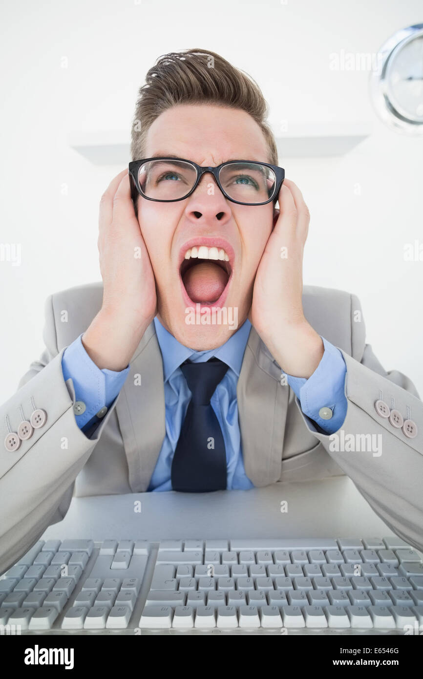 Angry businessman working on computer Stock Photo - Alamy