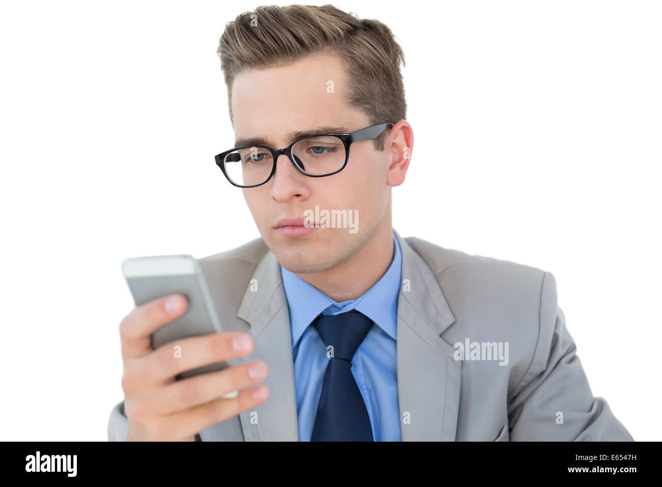 Frowning businessman sending text hi-res stock photography and images ...