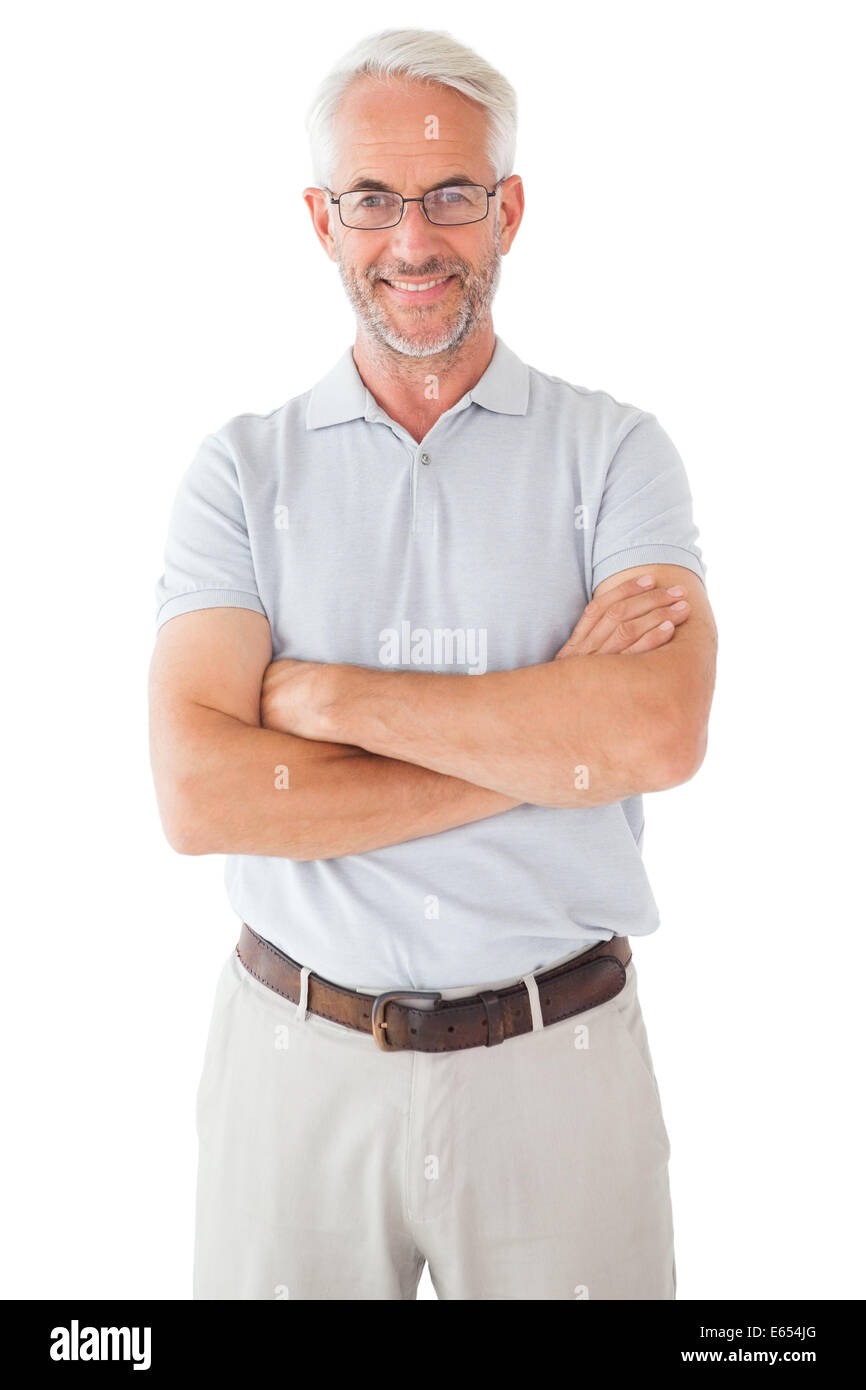 Smiling man posing with arms crossed Stock Photo - Alamy
