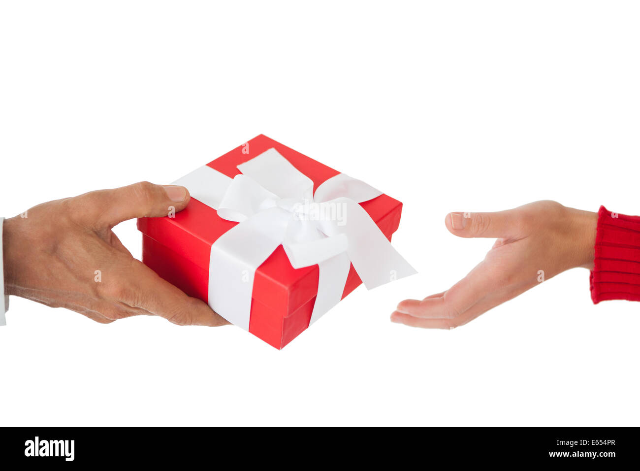 Couple passing a wrapped gift Stock Photo - Alamy