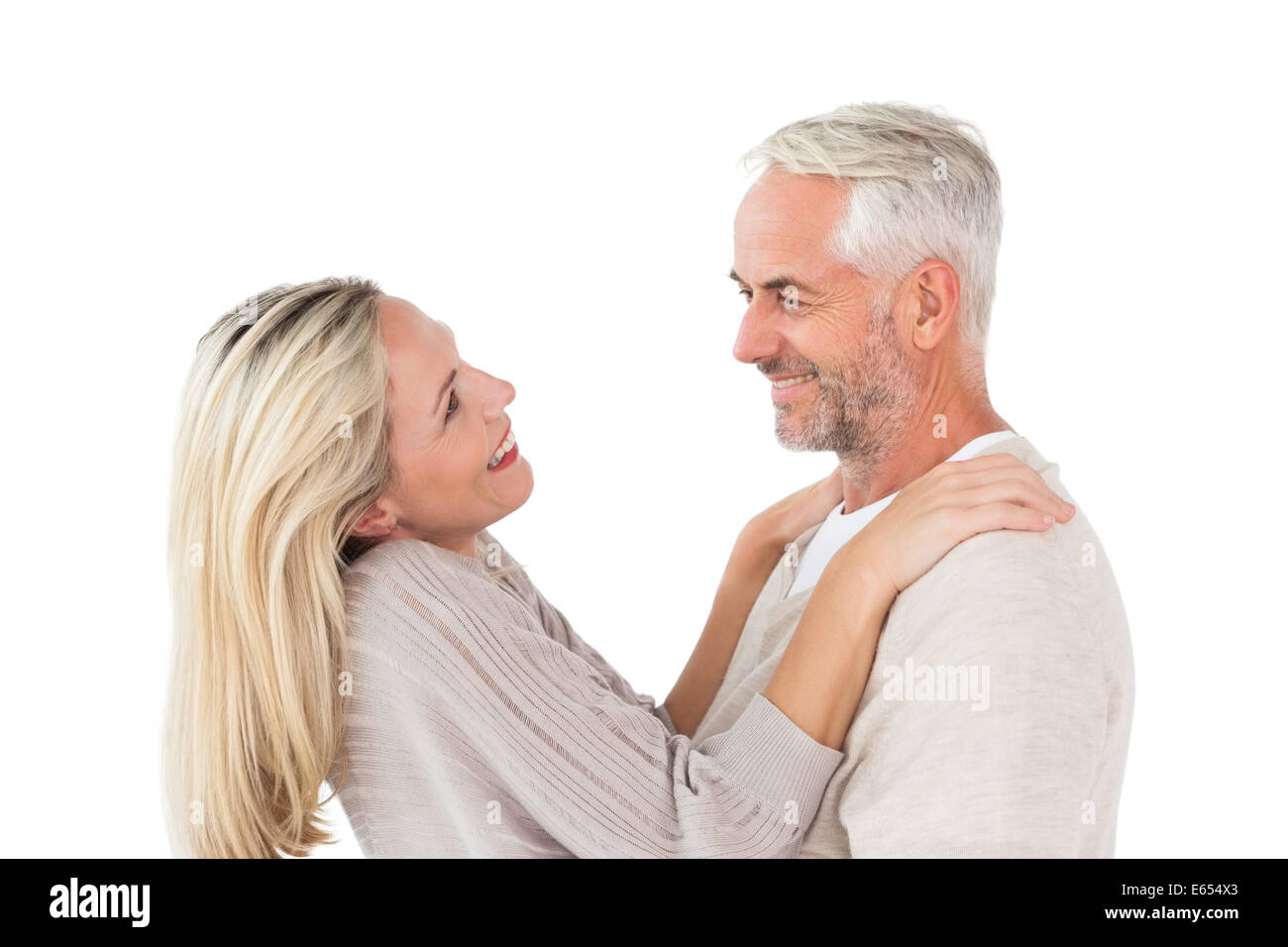 Happy couple standing and hugging Stock Photo - Alamy