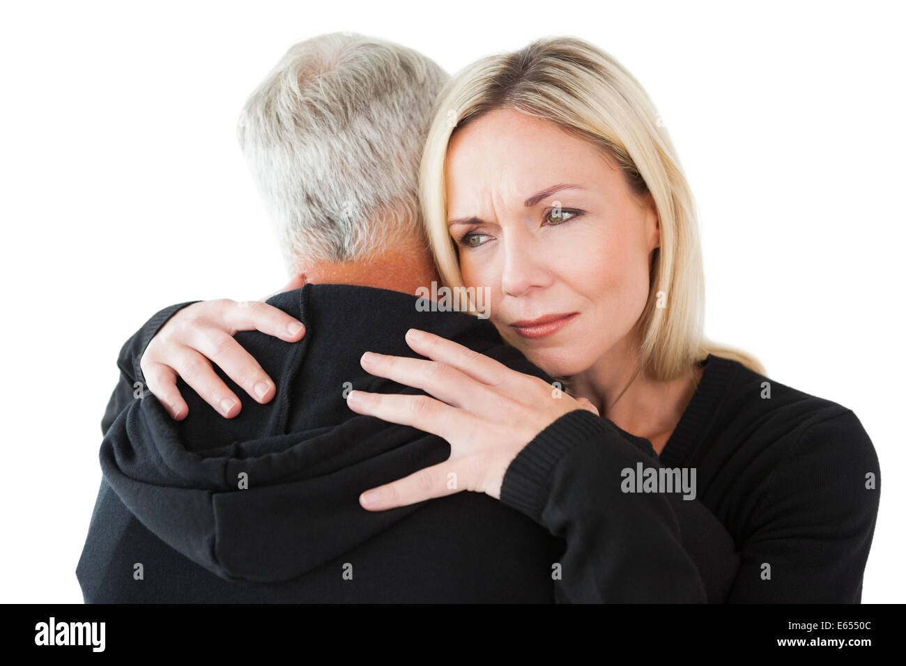 Emotional woman hugging her partner Stock Photo - Alamy