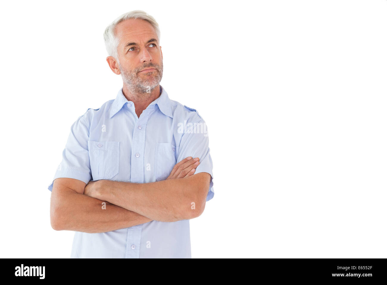 Thinking man posing with arms crossed Stock Photo - Alamy