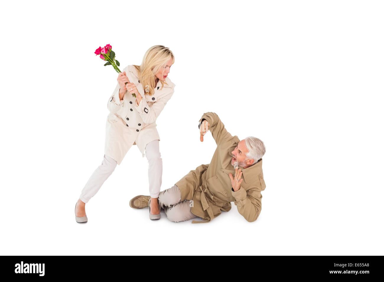 Angry woman attacking partner with rose bouquet Stock Photo - Alamy