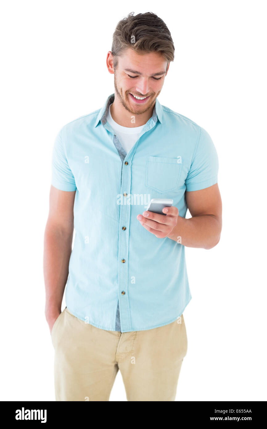 Handsome young man using his smartphone Stock Photo - Alamy