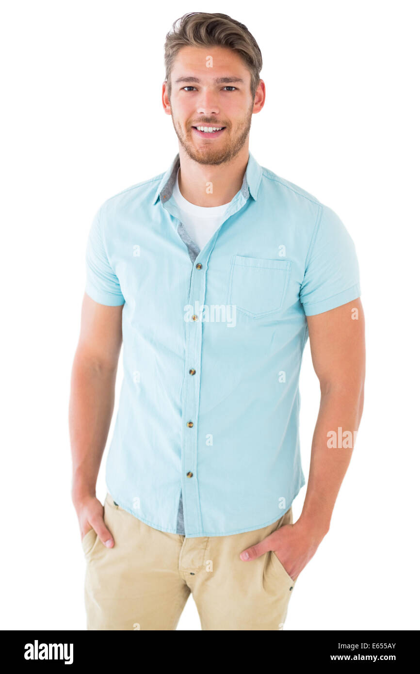 Handsome young man posing with hands in pockets Stock Photo - Alamy