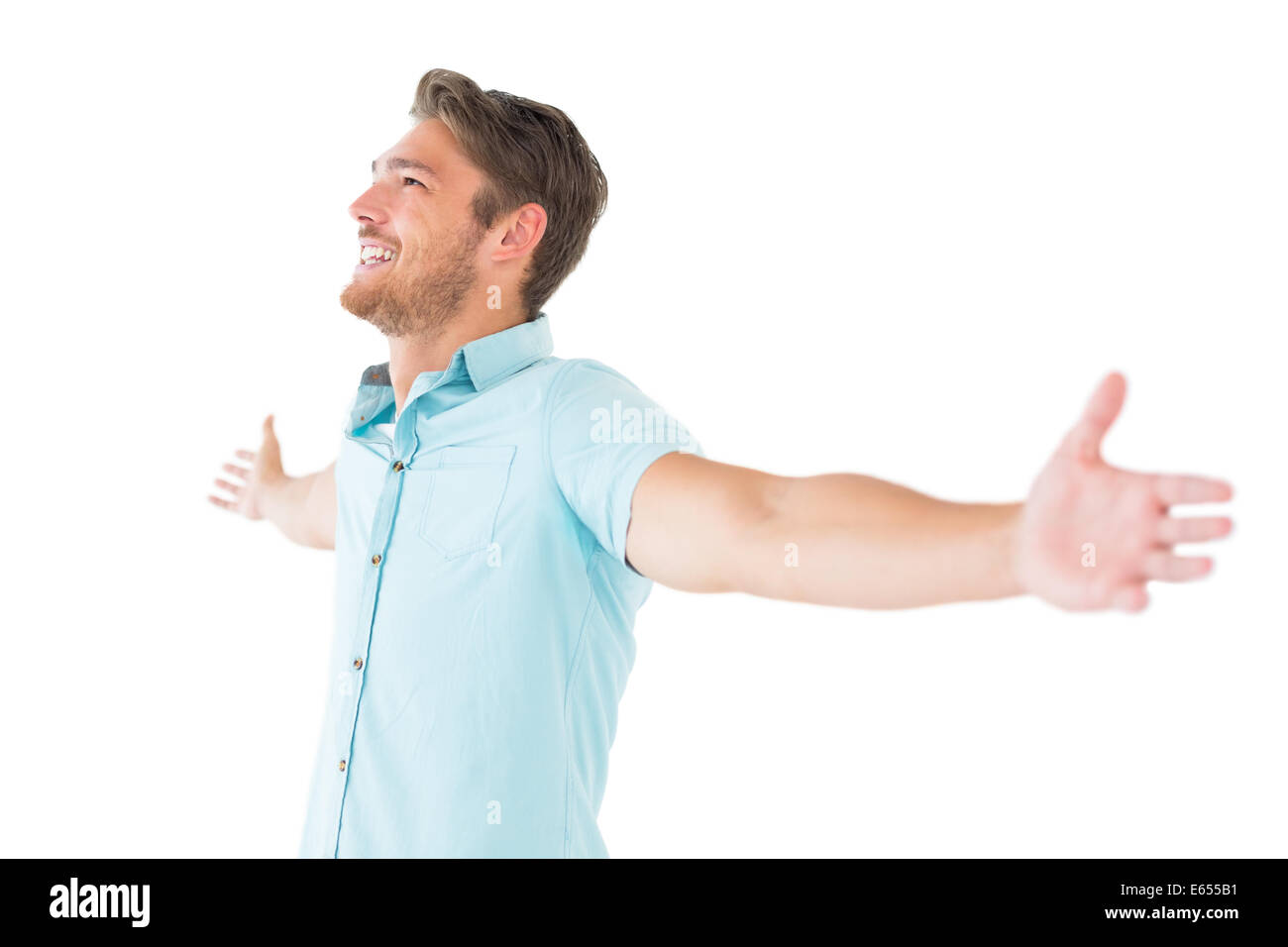 Handsome young man posing with arms out Stock Photo - Alamy