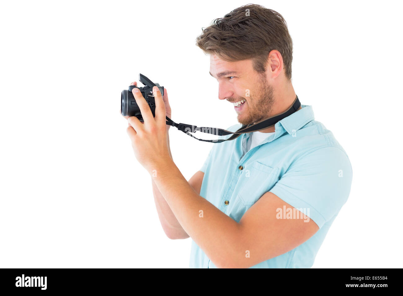 Handsome young man holding digital camera Stock Photo - Alamy