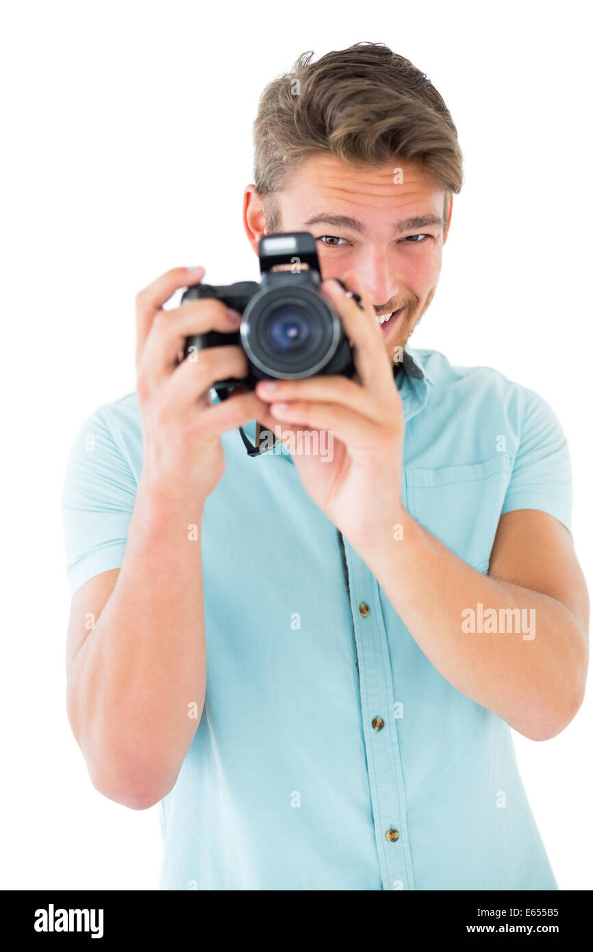 Handsome young man holding digital camera Stock Photo - Alamy