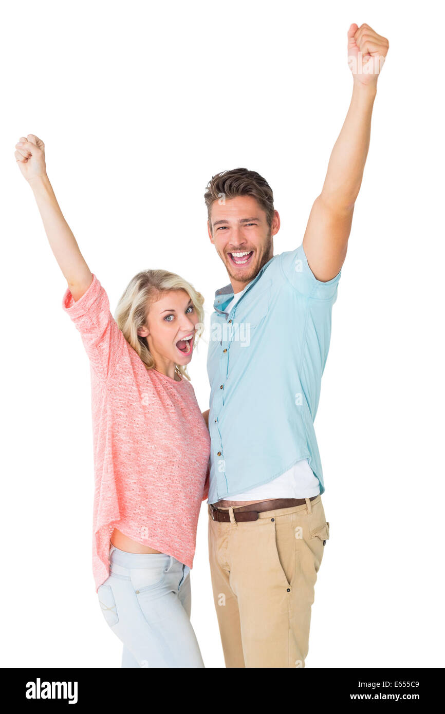 Attractive couple smiling and cheering Stock Photo - Alamy