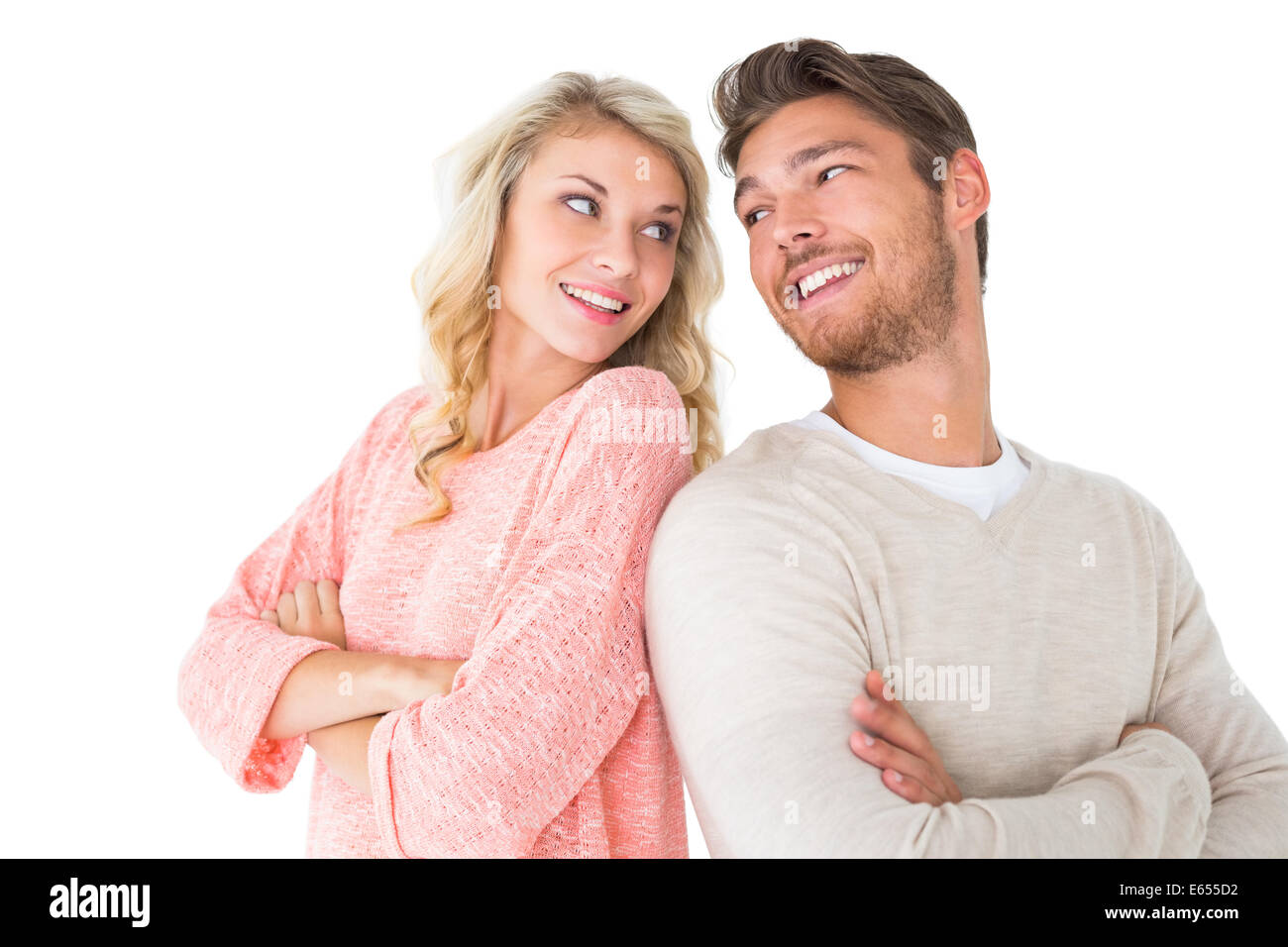 Attractive couple smiling with arms crossed Stock Photo - Alamy