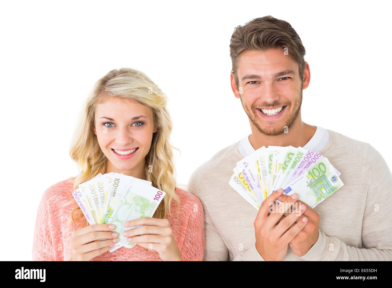 Attractive couple flashing their cash Stock Photo - Alamy