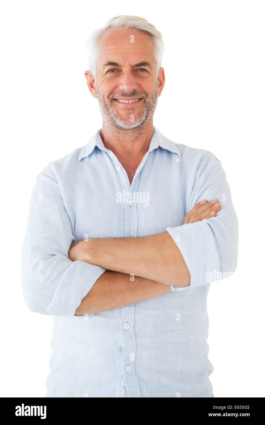 Smiling man posing with arms crossed Stock Photo - Alamy