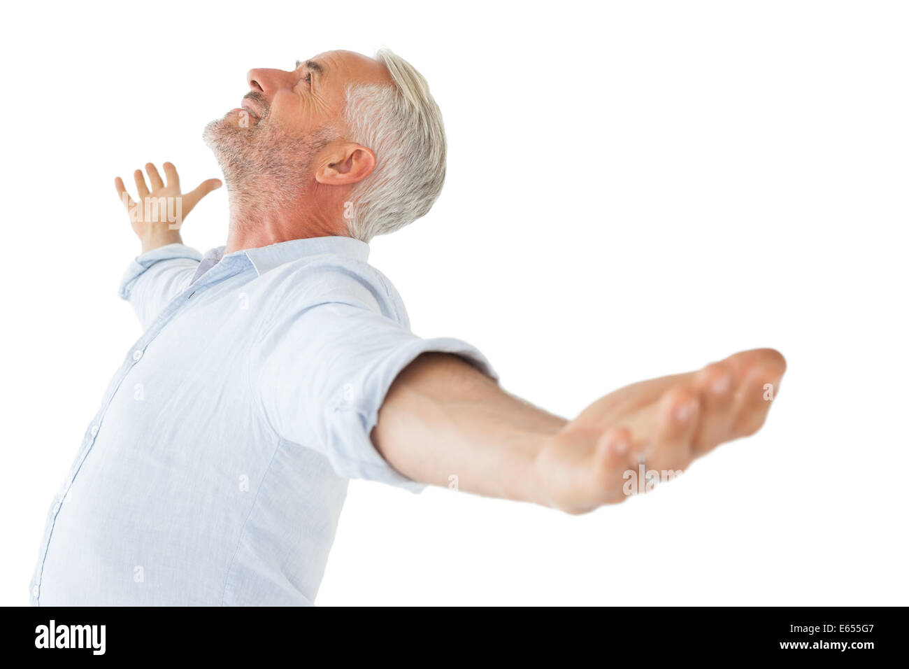 Smiling man posing with arms out Stock Photo - Alamy