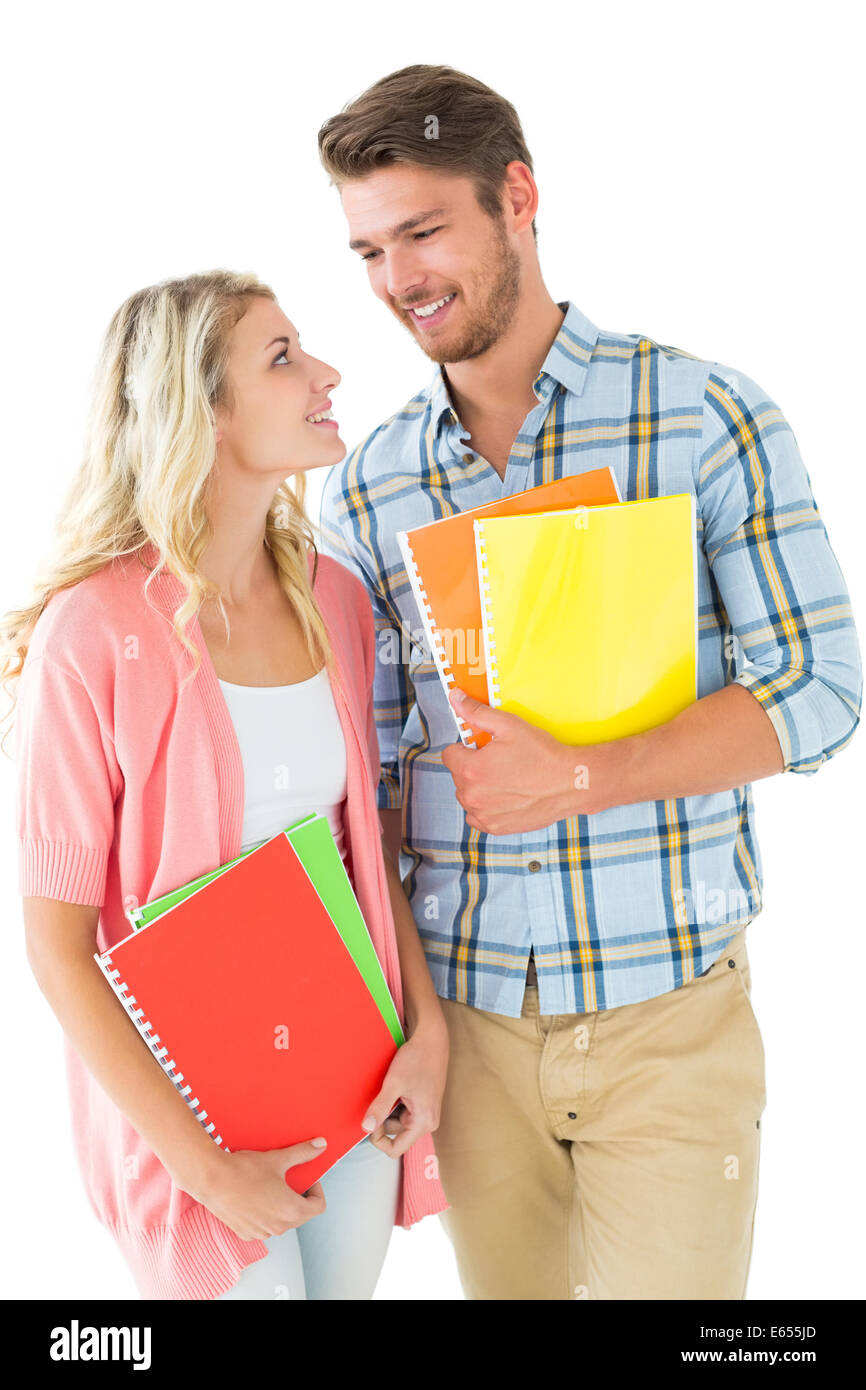 Attractive student couple smiling at each other Stock Photo - Alamy