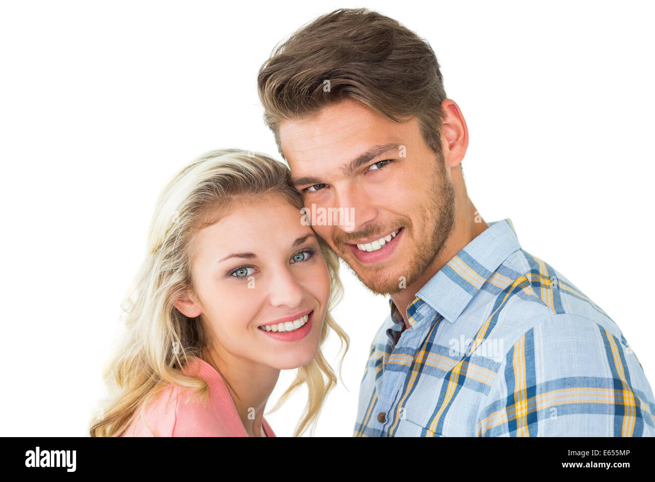 Attractive couple smiling at camera Stock Photo - Alamy