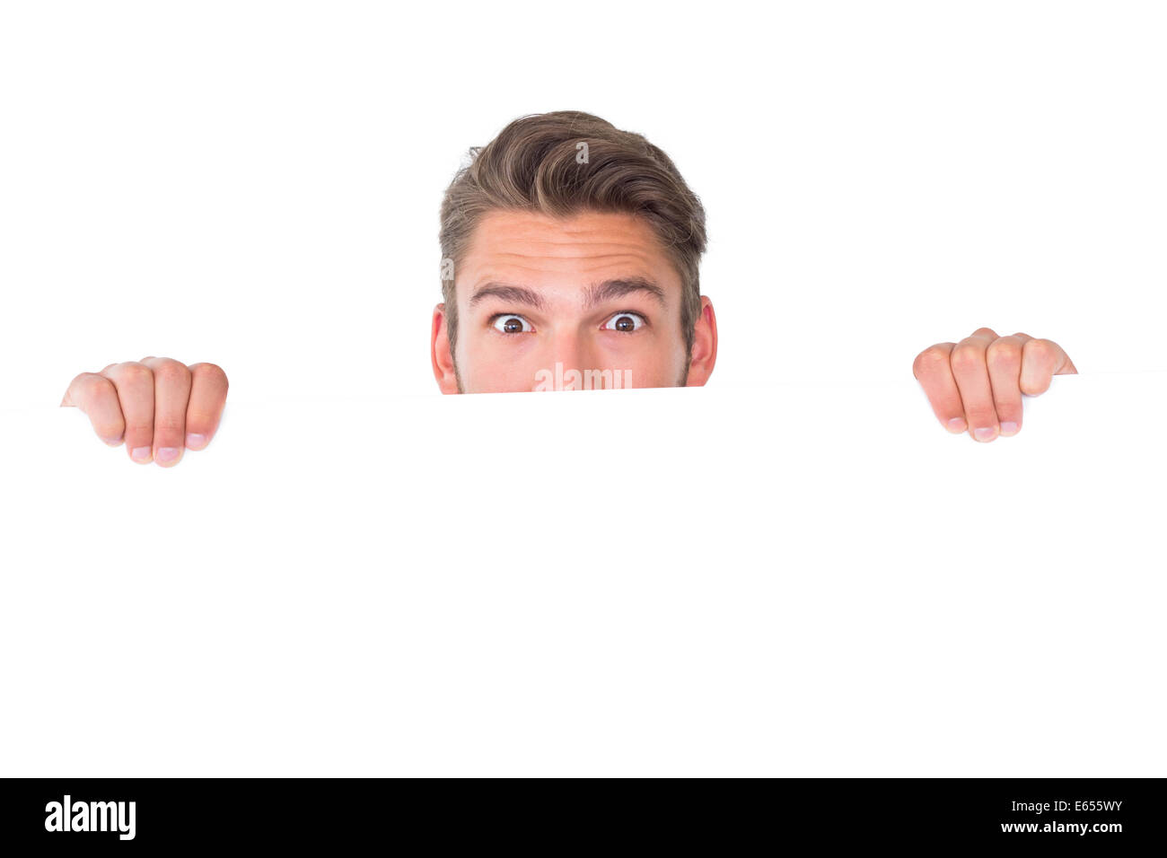 Handsome young man showing poster Stock Photo - Alamy