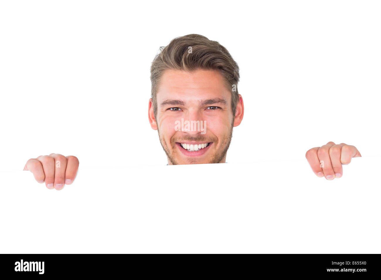 Handsome young man showing poster Stock Photo - Alamy