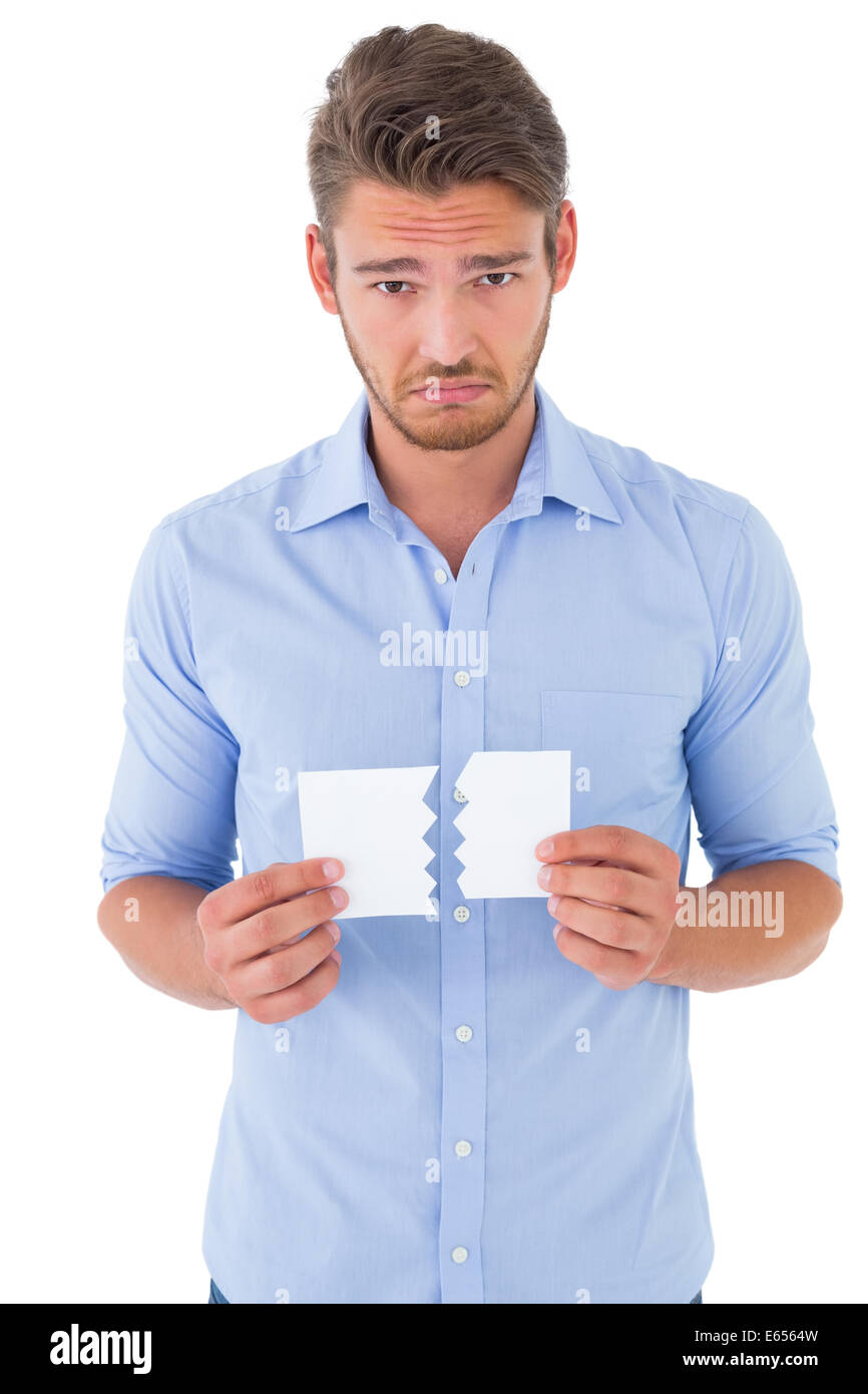 Sad man holding a broken card Stock Photo - Alamy