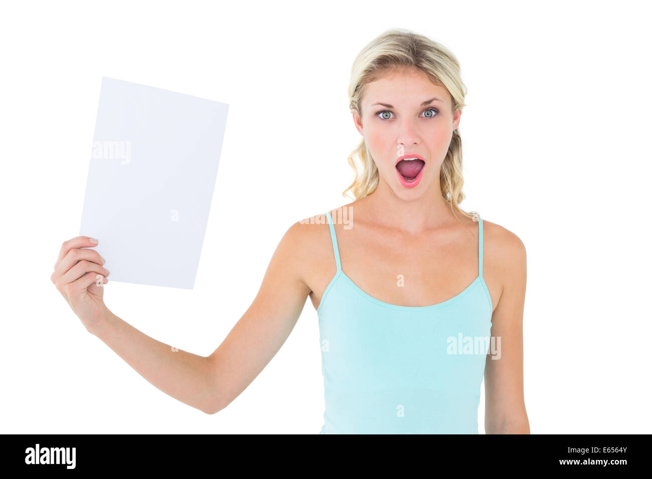 Shocked blonde holding a sheet of paper Stock Photo - Alamy