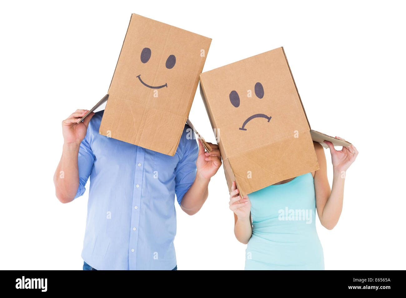 Couple wearing sad face boxes on their heads Stock Photo - Alamy
